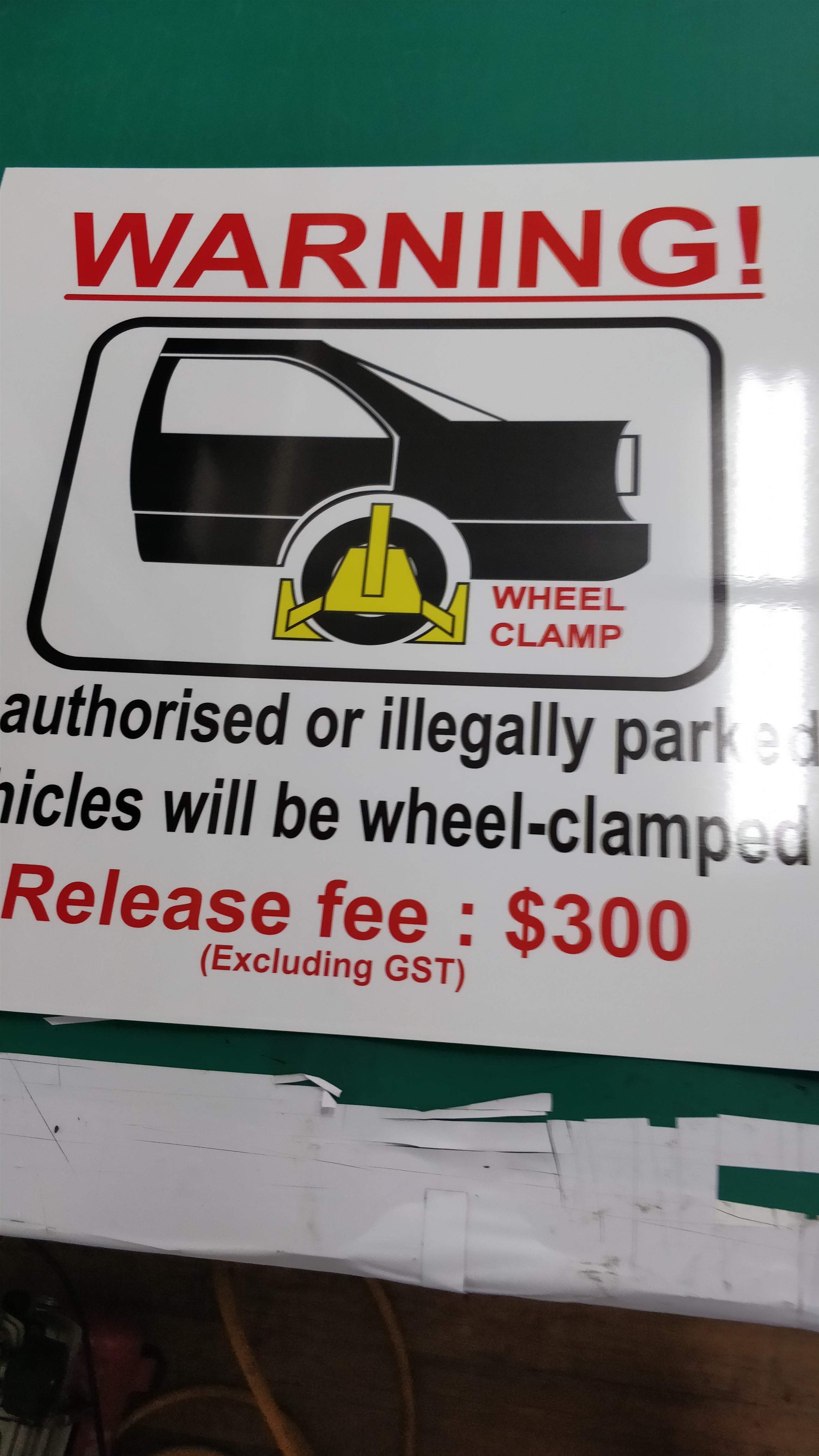 WHEEL CLAMP SIGNAGE RELEASE FEE $300 - www.fatherland.com.sg